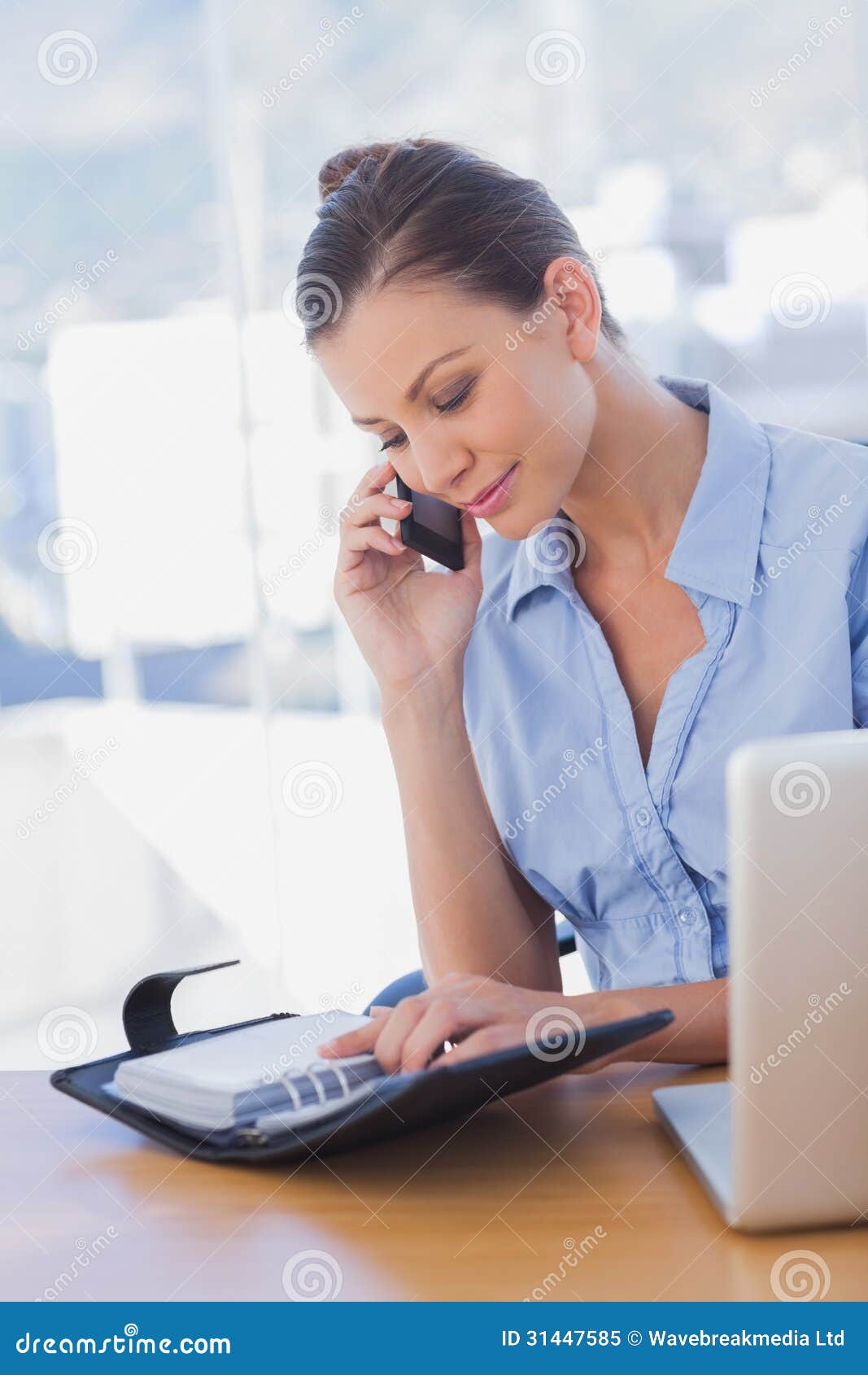 Happy Businesswoman Looking at Her Diary and Calling Stock Image ...