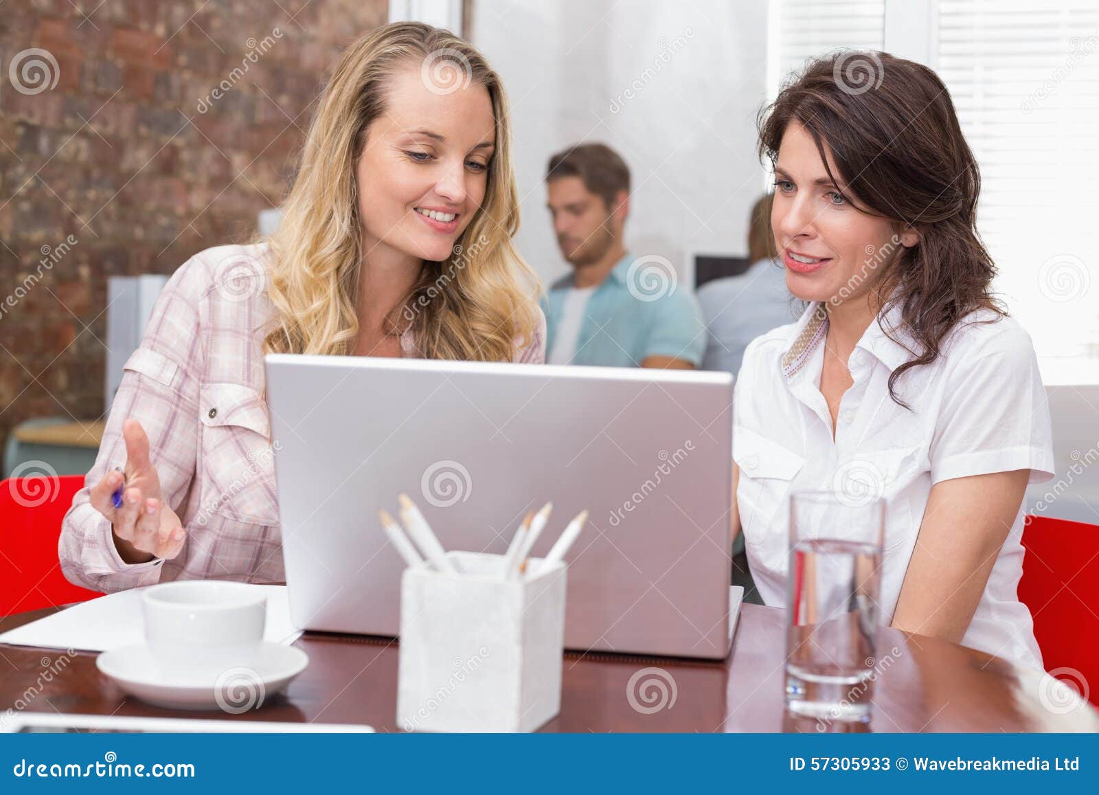 Happy Businesswomen Looking at Computer Screen Together Stock Image ...