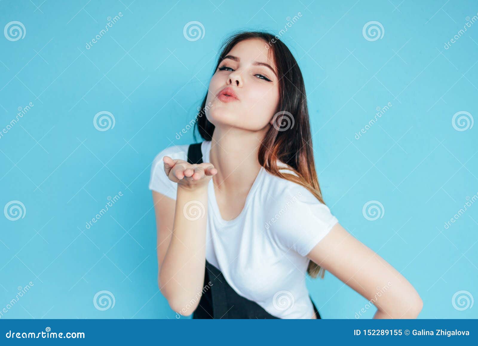 Happy Carefree Smiling Teenager Girl With Dark Long Hair In White T