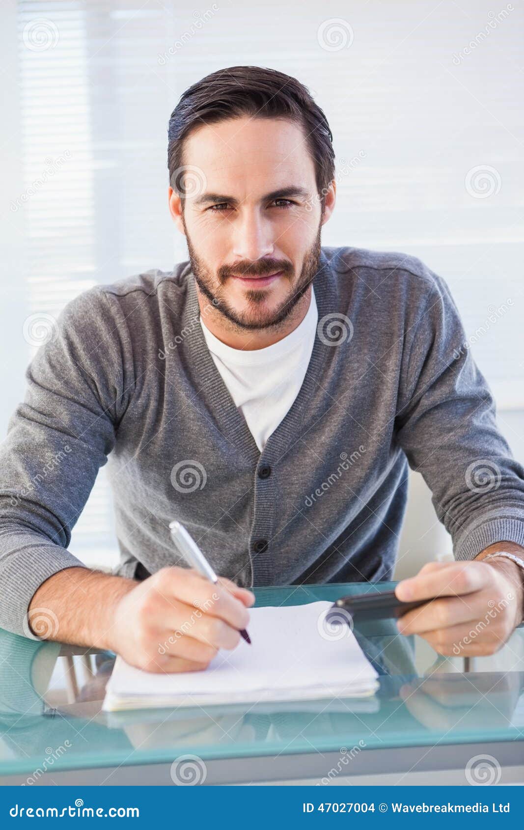 Happy Casual Man Writing on Sheets Paying Bills Stock Photo - Image of ...
