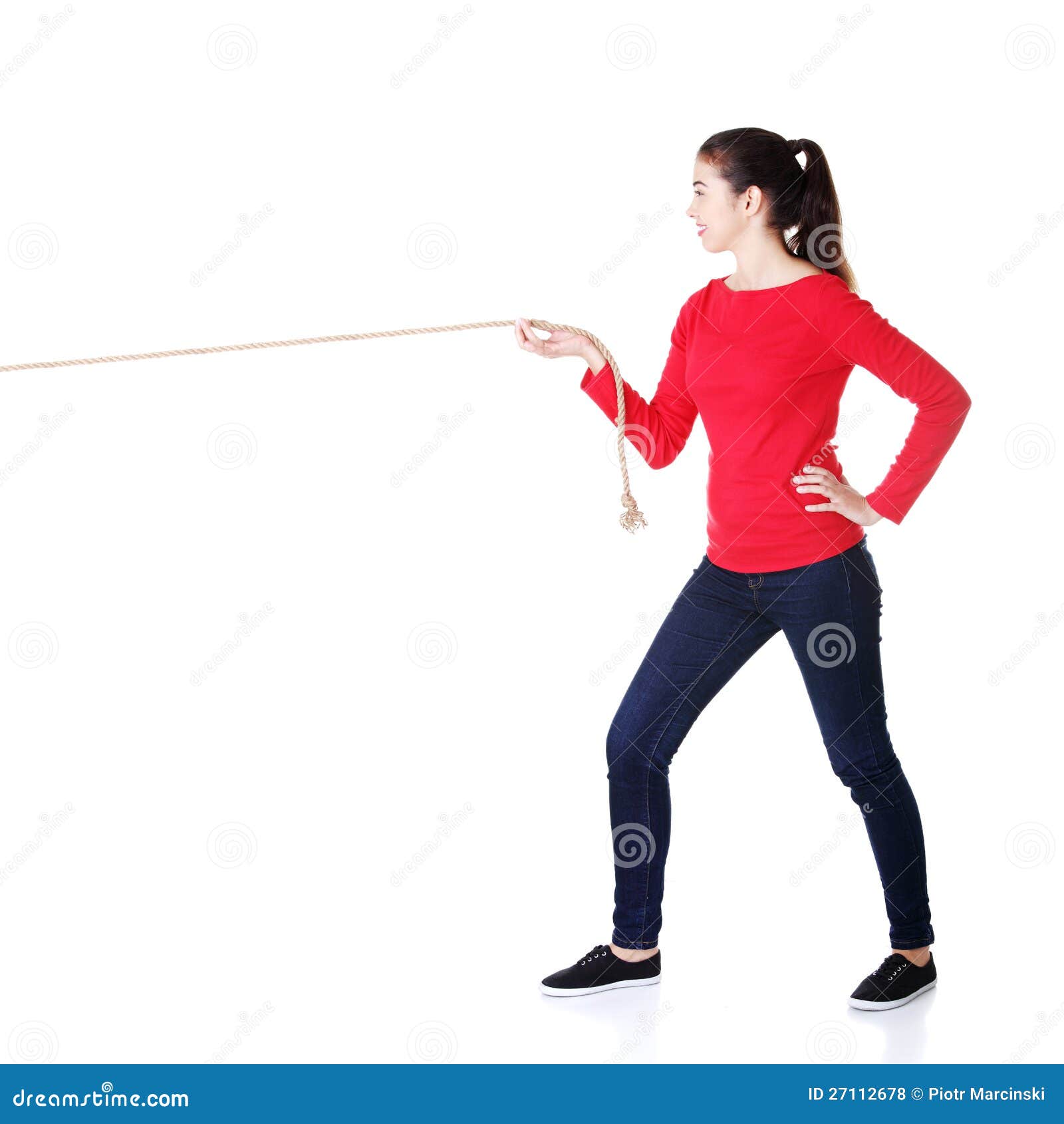 Happy Casual Woman Pulling a Rope with Ease Stock Photo - Image of ...