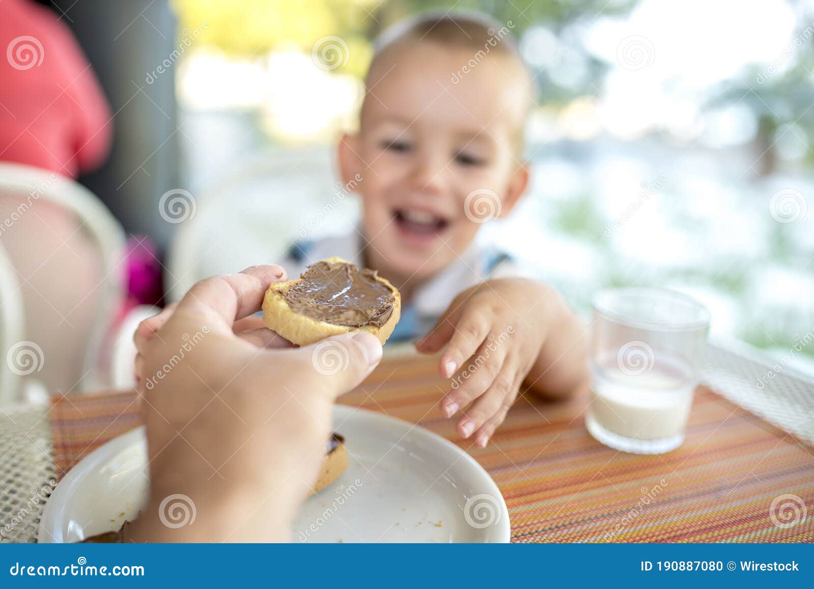 Happy Caucasian Child Eating Bread with Chocolate for Breakfast Stock ...