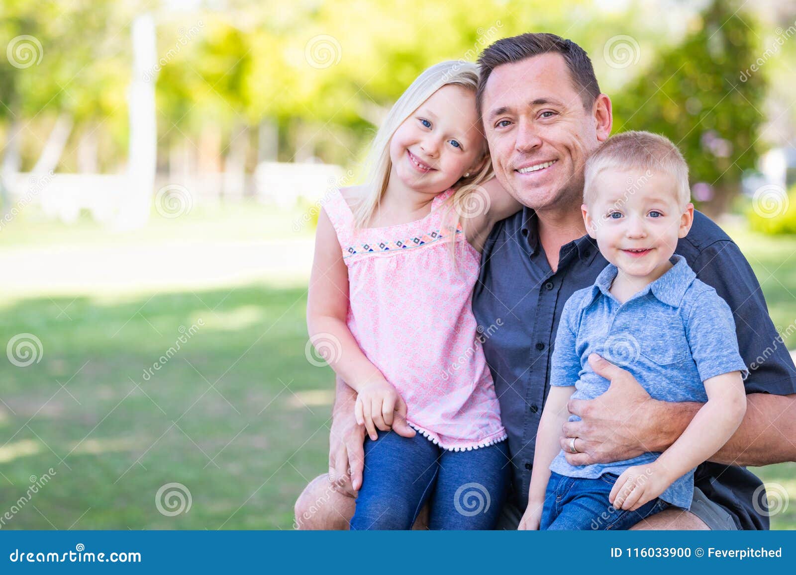 Happy Caucasian Dad Son And Daughter Having Fun In The Park Stock
