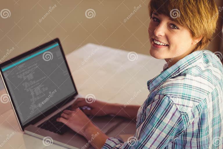 Happy Caucasian Female Programmer Siting at Desk, Using Laptop with Coding on Screen Stock Photo ...