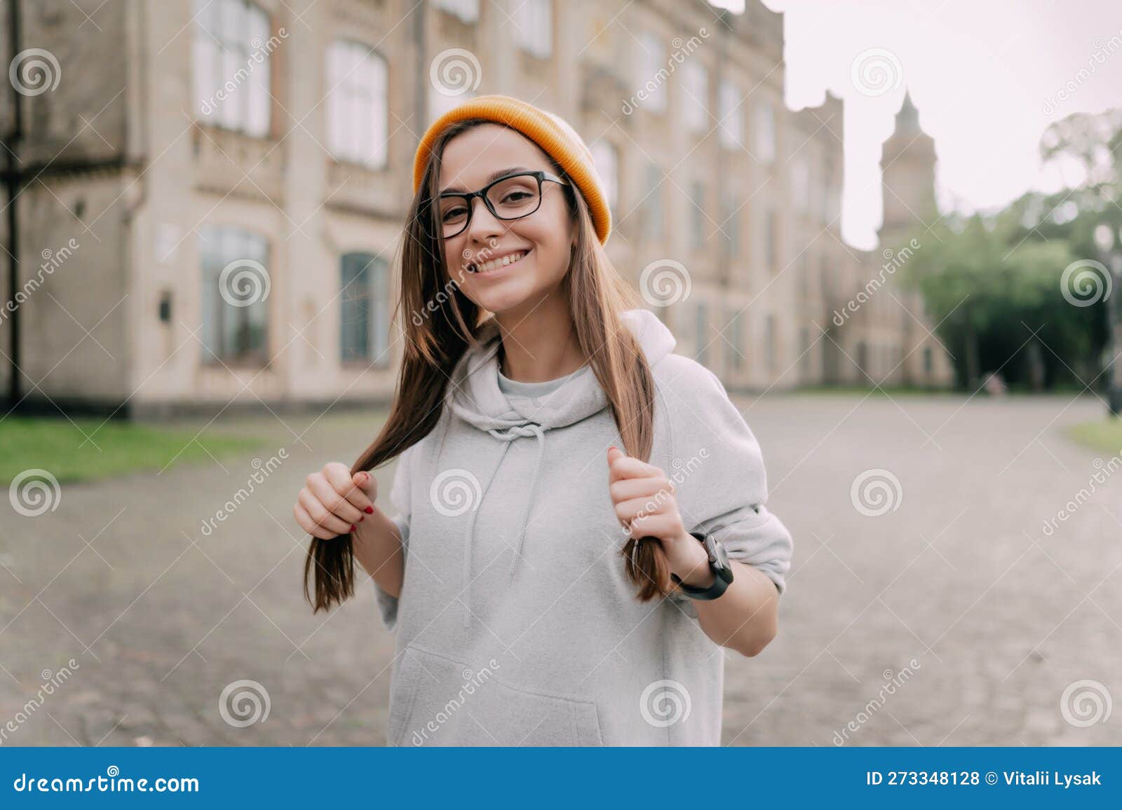 Happy Caucasian Female Student Walking Around the Campus Smiling at the ...