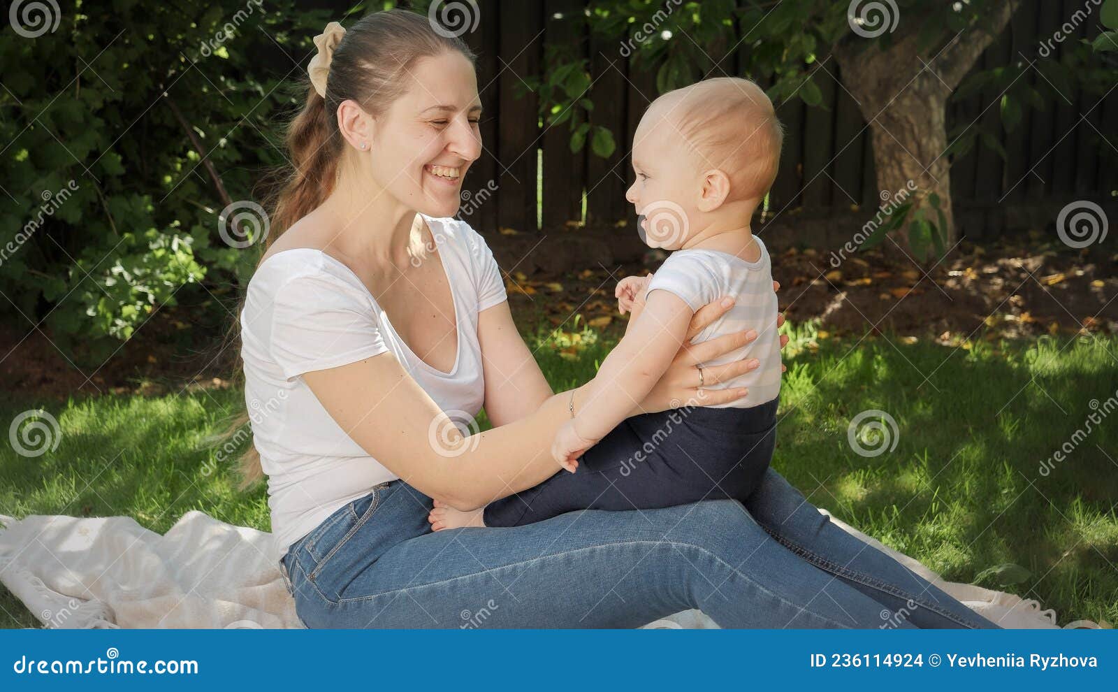 Happy Cheerful Baby Boy with Mother Relaxing on Blanket in Park on ... Happy Cheerful Baby Boy with Mother Relaxing on Blanket in Park on ...