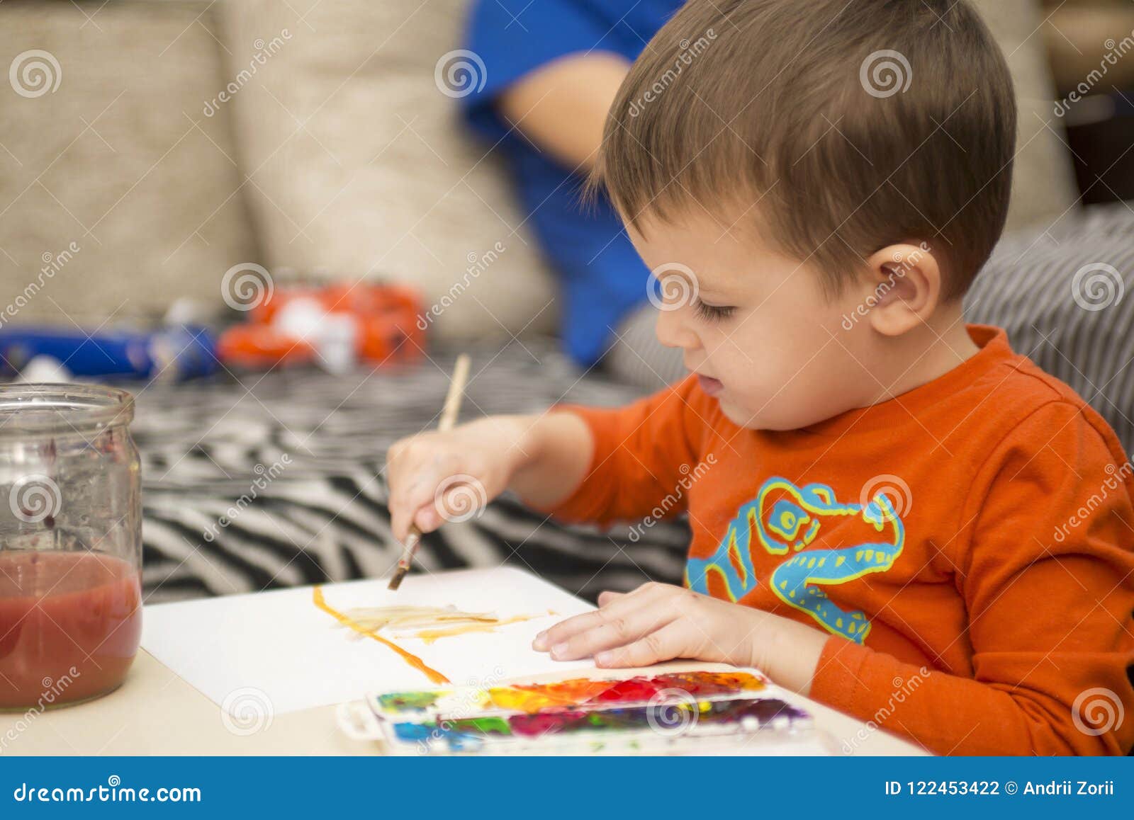 Happy Cheerful Child Drawing with Brush Using a Painting Tools ...