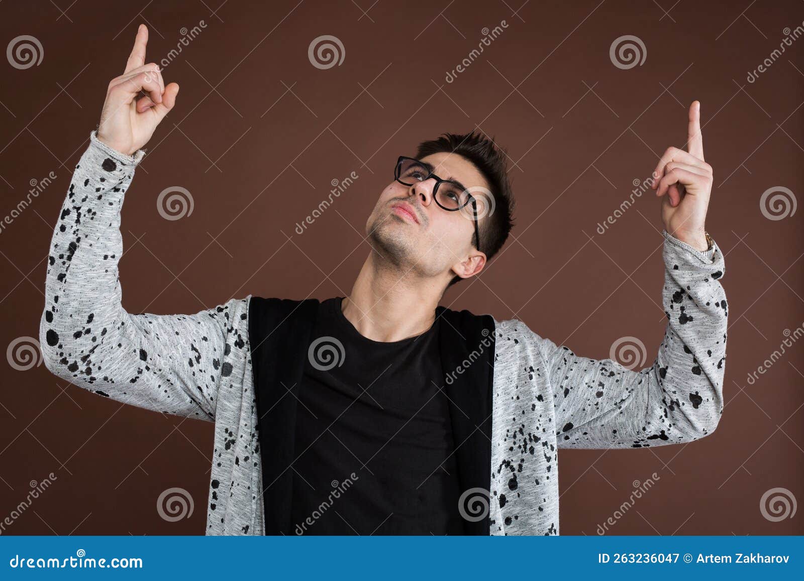 Happy Cheerful Young Guy Gesturing Up with Fingers. Stock Image - Image ...