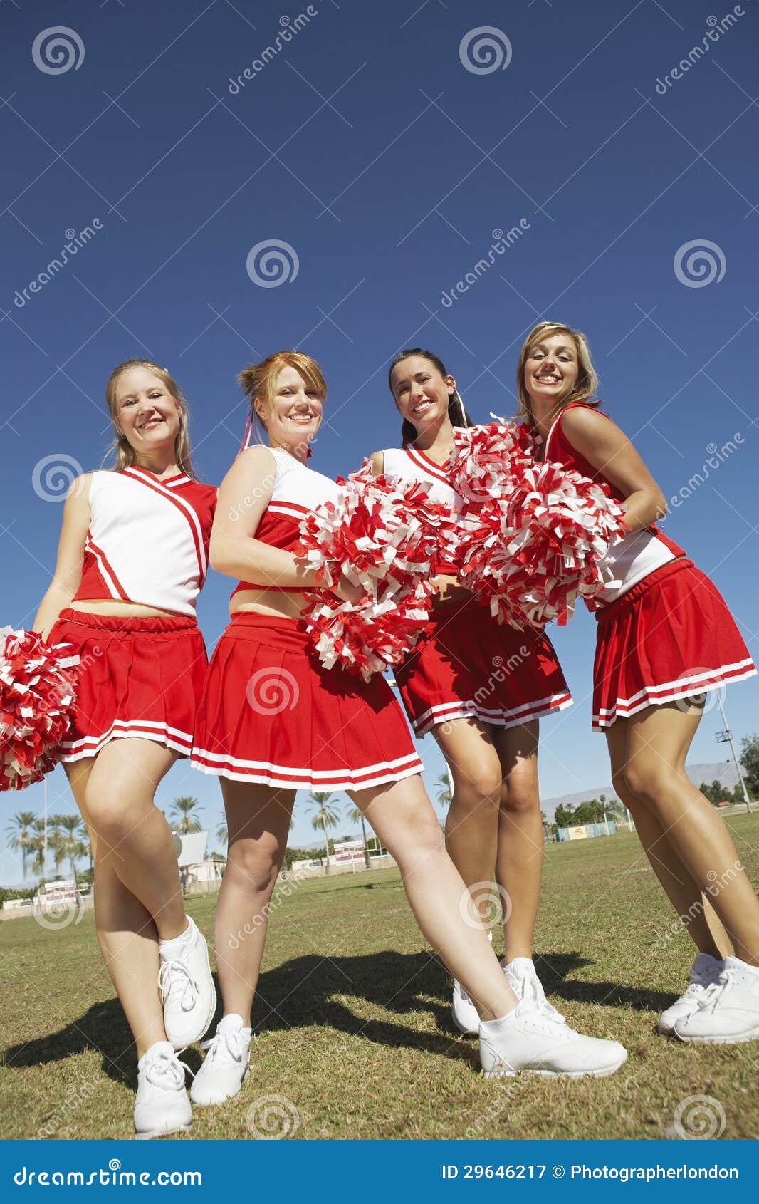 Happy Cheerleaders on Field Stock Image - Image of cheering, outdoors ...