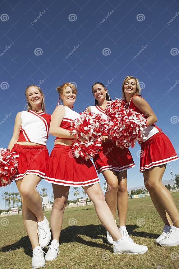 Happy Cheerleaders on Field Stock Image - Image of cheering, outdoors ...