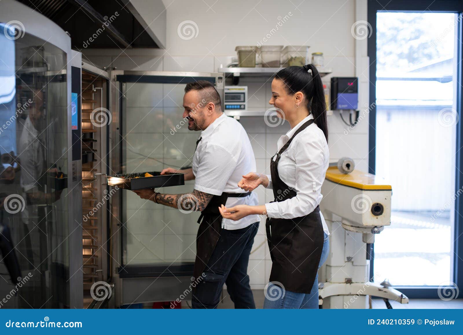 Happy Chef and Cook Working on Their Dishes Indoors in Restaurant ...