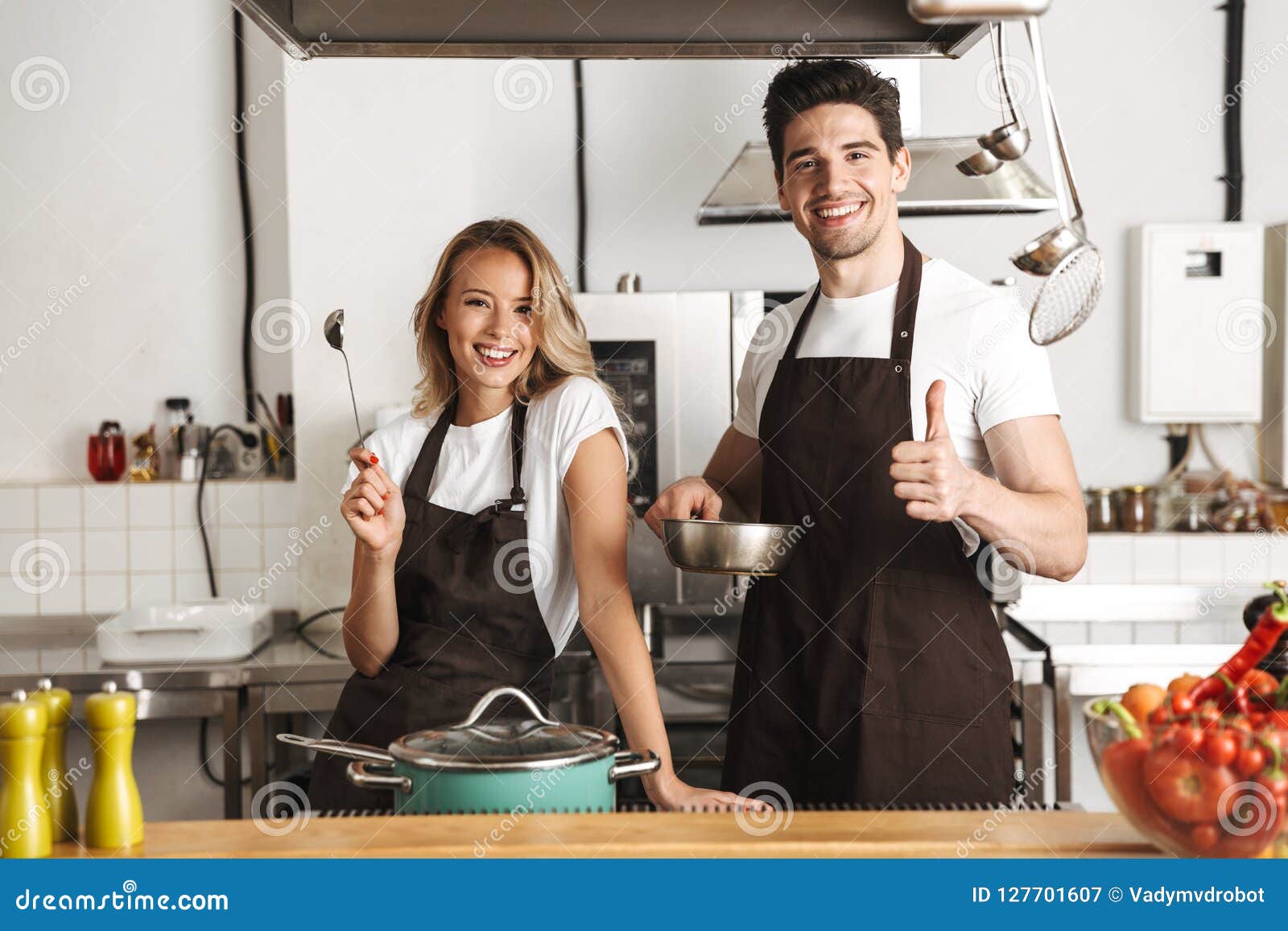 Happy Chef Couple Dressed in Aprons Cooking Together Stock Image ...