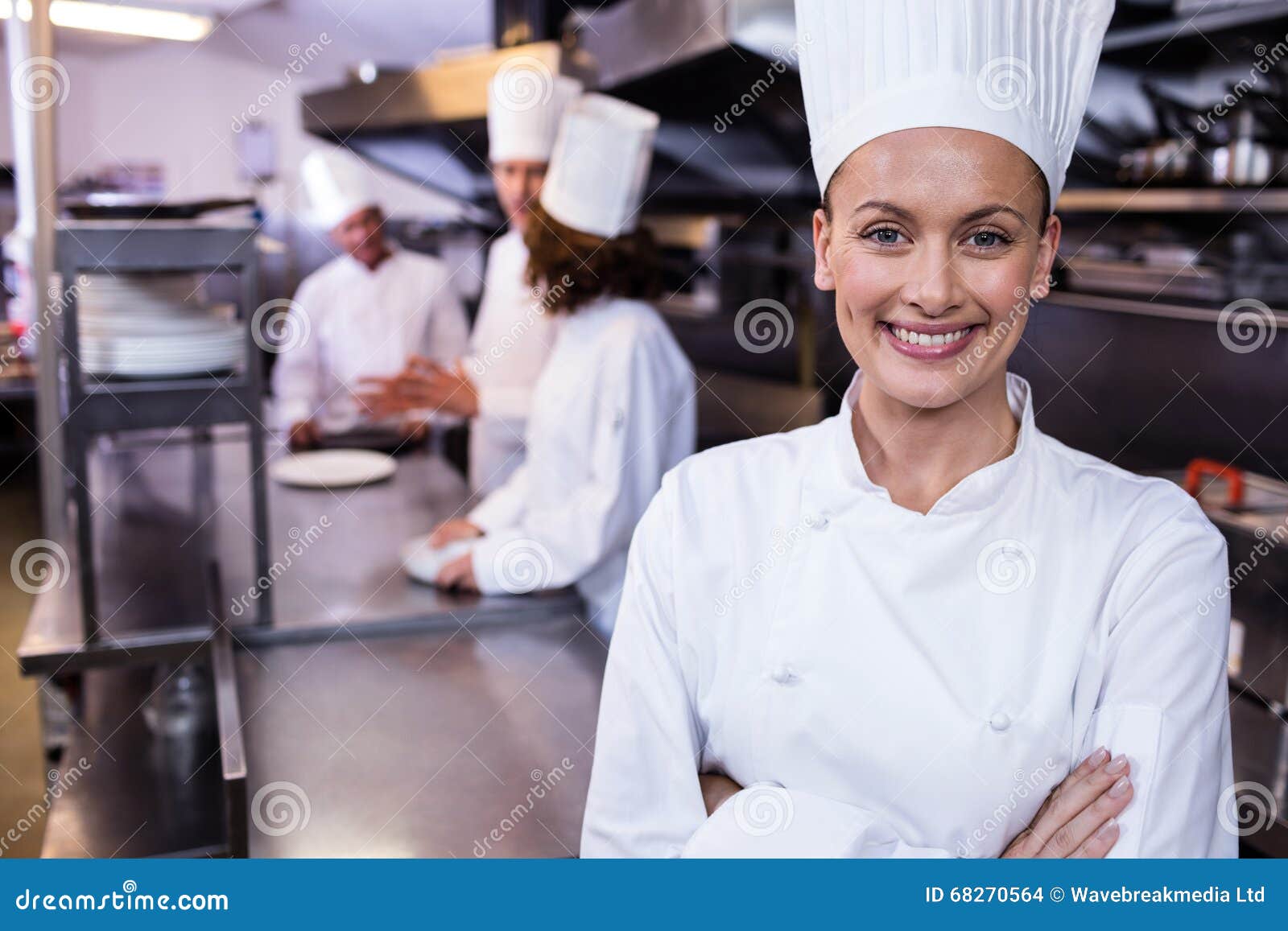 Happy Chef Standing In Commercial Kitchen In A Restaurant Stock ...