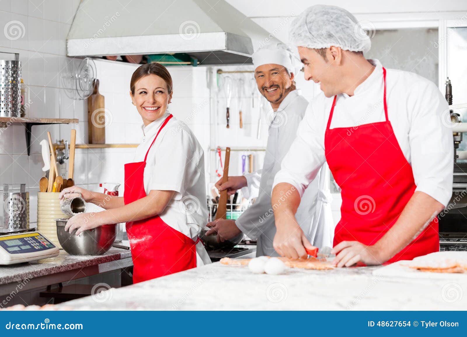 Happy Chefs Conversing in Commercial Kitchen Stock Photo - Image of ...