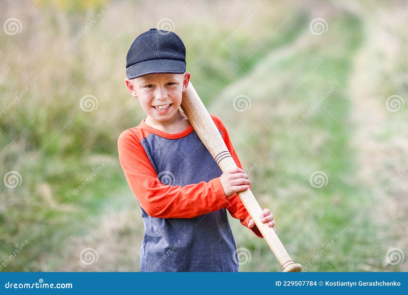 A Happy Child with Baseball Bat on Nature Concept in Park Stock Photo ...