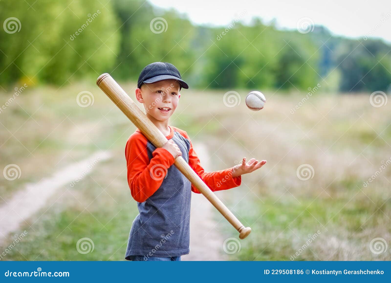 A Happy Child with Baseball Bat on Nature Concept in Park Stock Photo ...