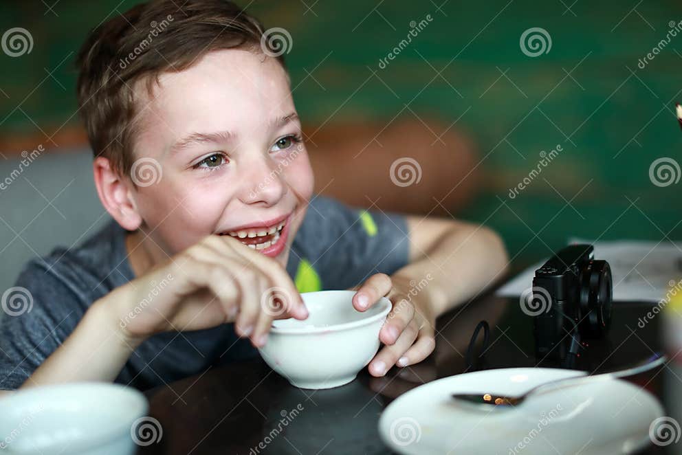 Happy child drinking tea stock photo. Image of beverage - 156421628