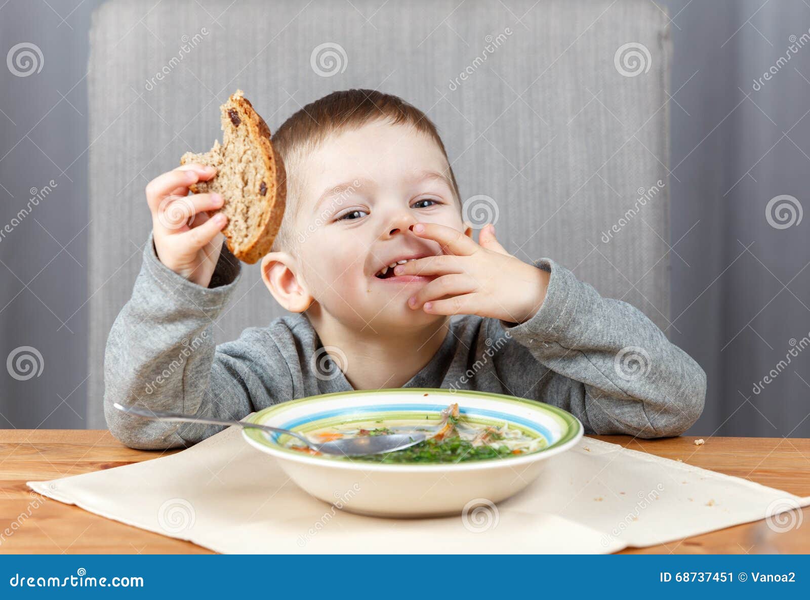 Happy Child Eating Bread for Dinner Stock Image - Image of delicious ...