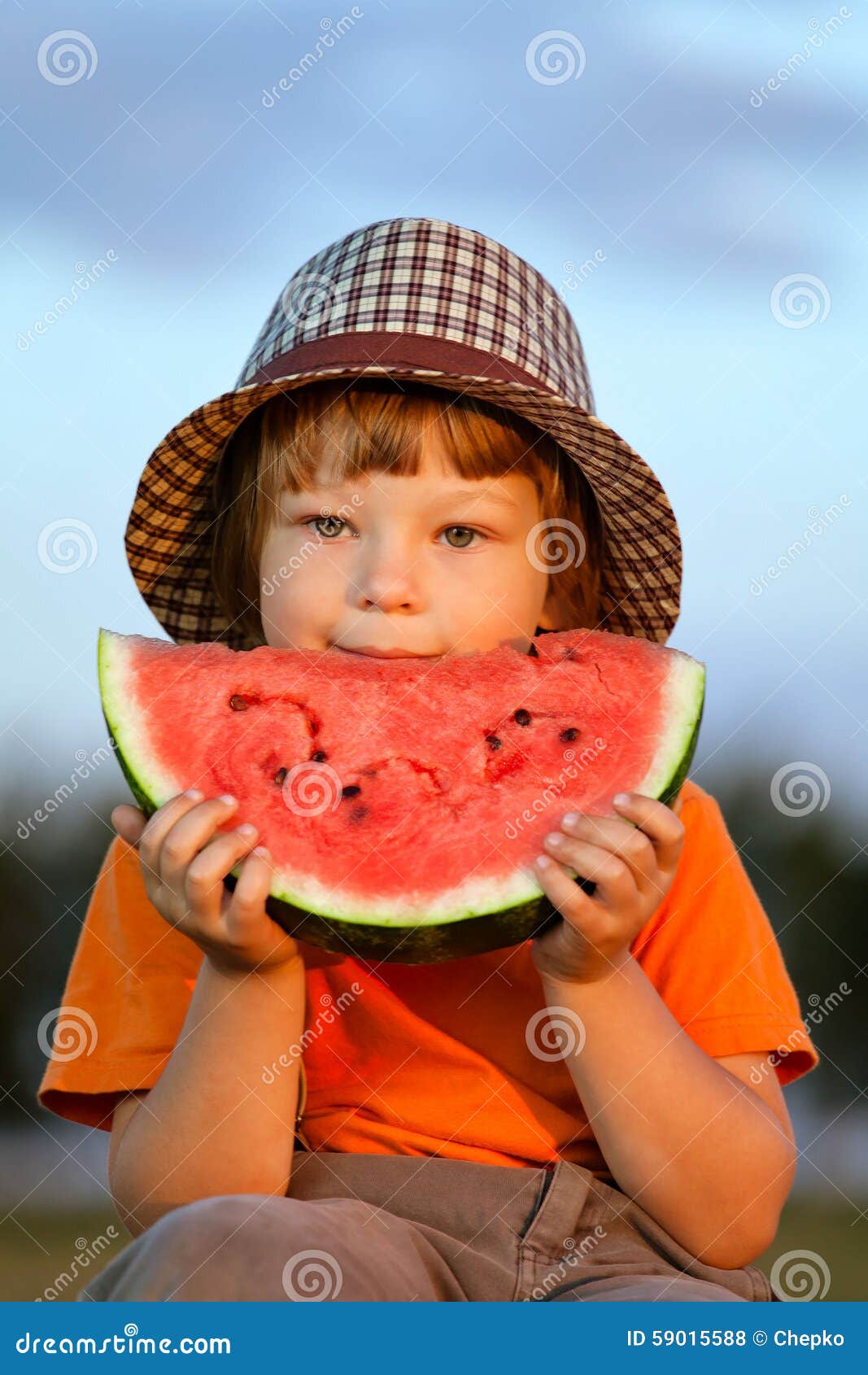 Happy Child Eating Watermelon Stock Photo - Image of autumn, grass ...