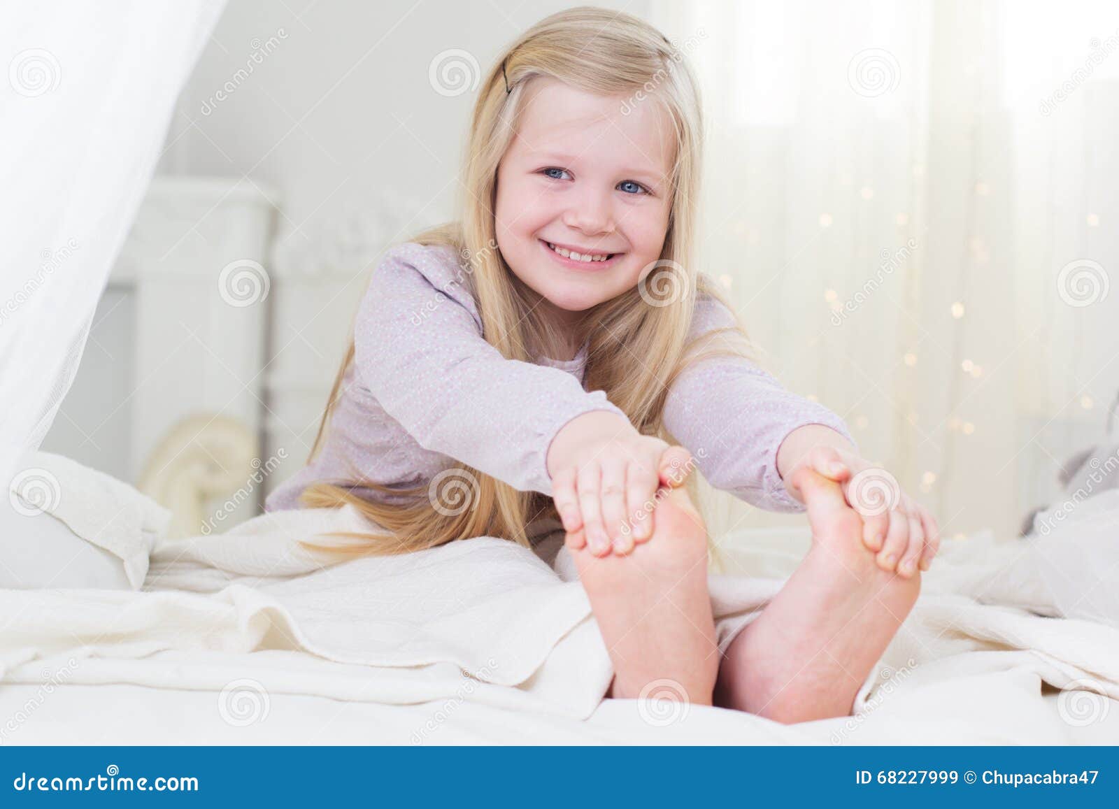 Happy Child Girl is Smiling in the Bed Barefoot Stock Image - Image of ... Happy Child Girl is Smiling in the Bed Barefoot Stock Image - Image of ...