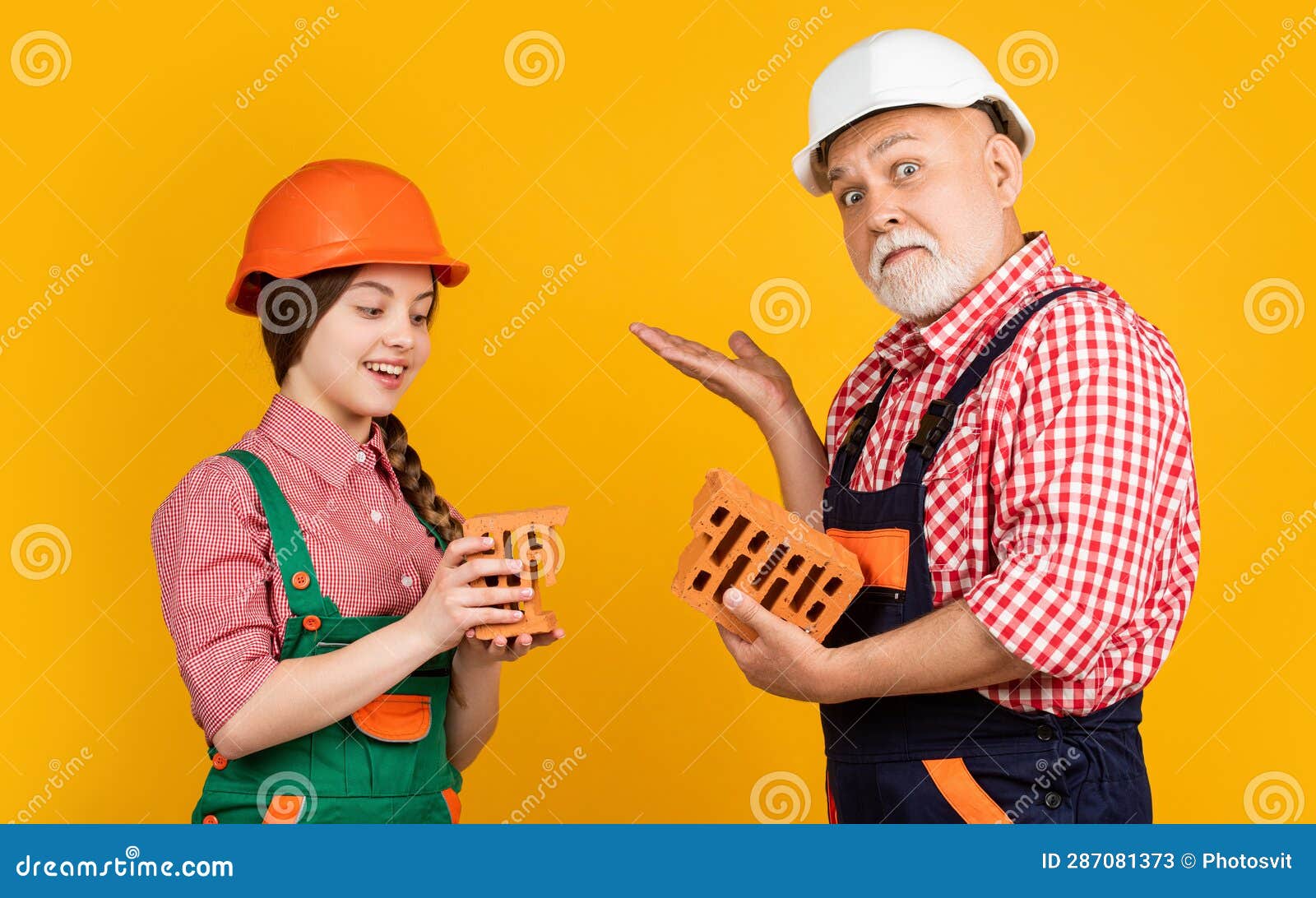 Happy Child and Grandfather Bricklayer in Hard Hat on Yellow Background ...