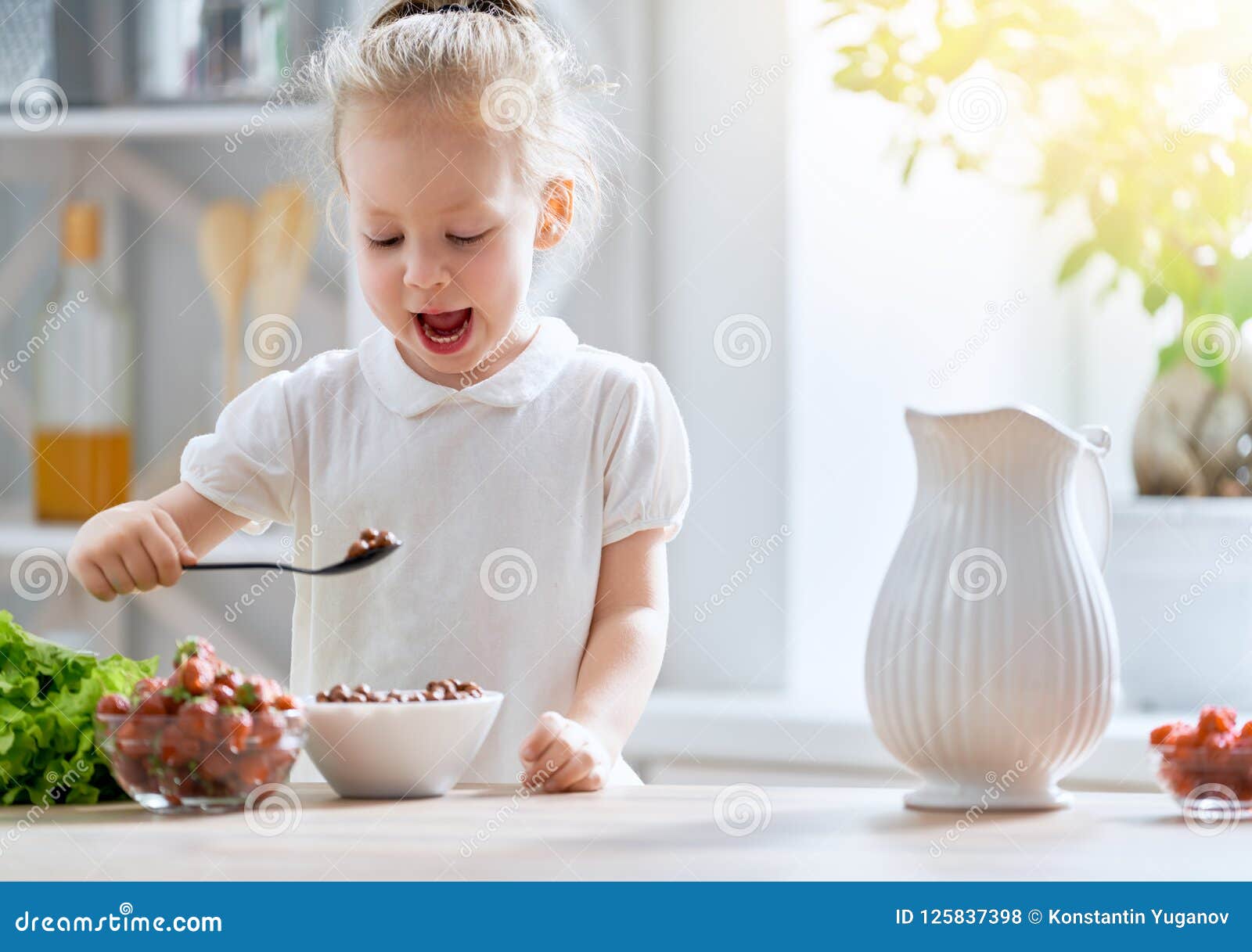 Child having breakfast stock photo. Image of daughter - 125837398