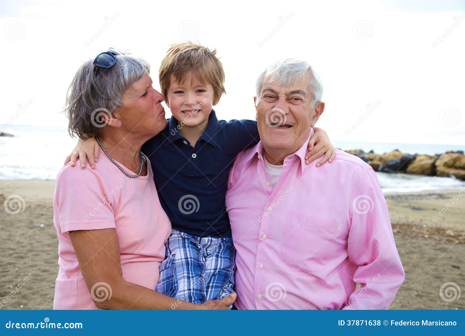 Happy Child Hugging Grandparents in Summer Stock Photo - Image of ...