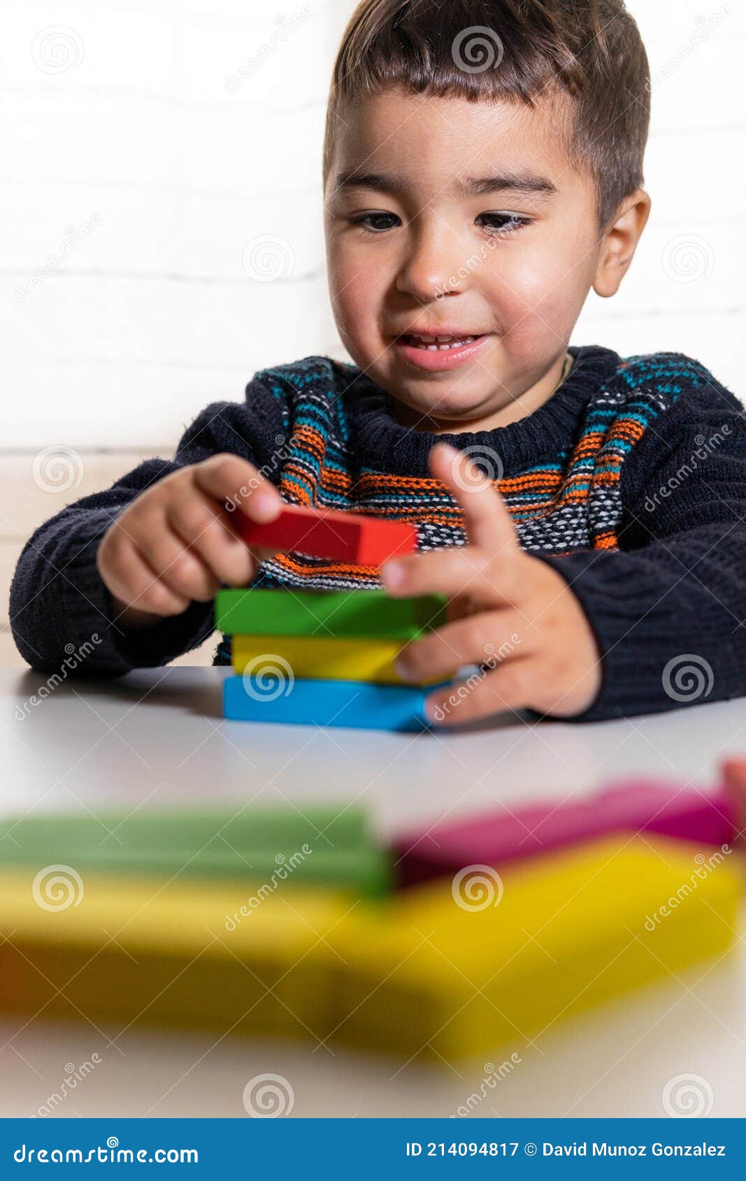 Happy Child Playing Building Blocks. Playing and Learning at Home ...