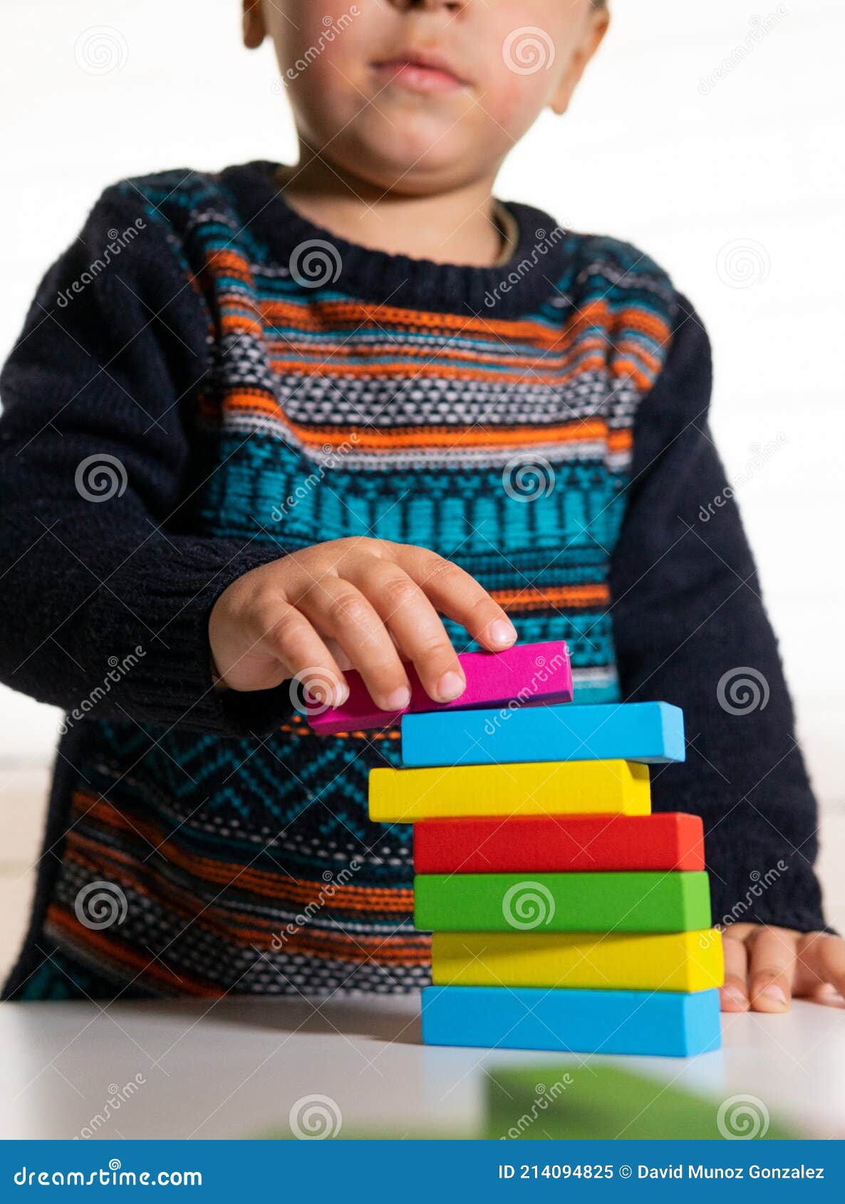 Happy Child Playing Building Blocks. Playing and Learning at Home ...