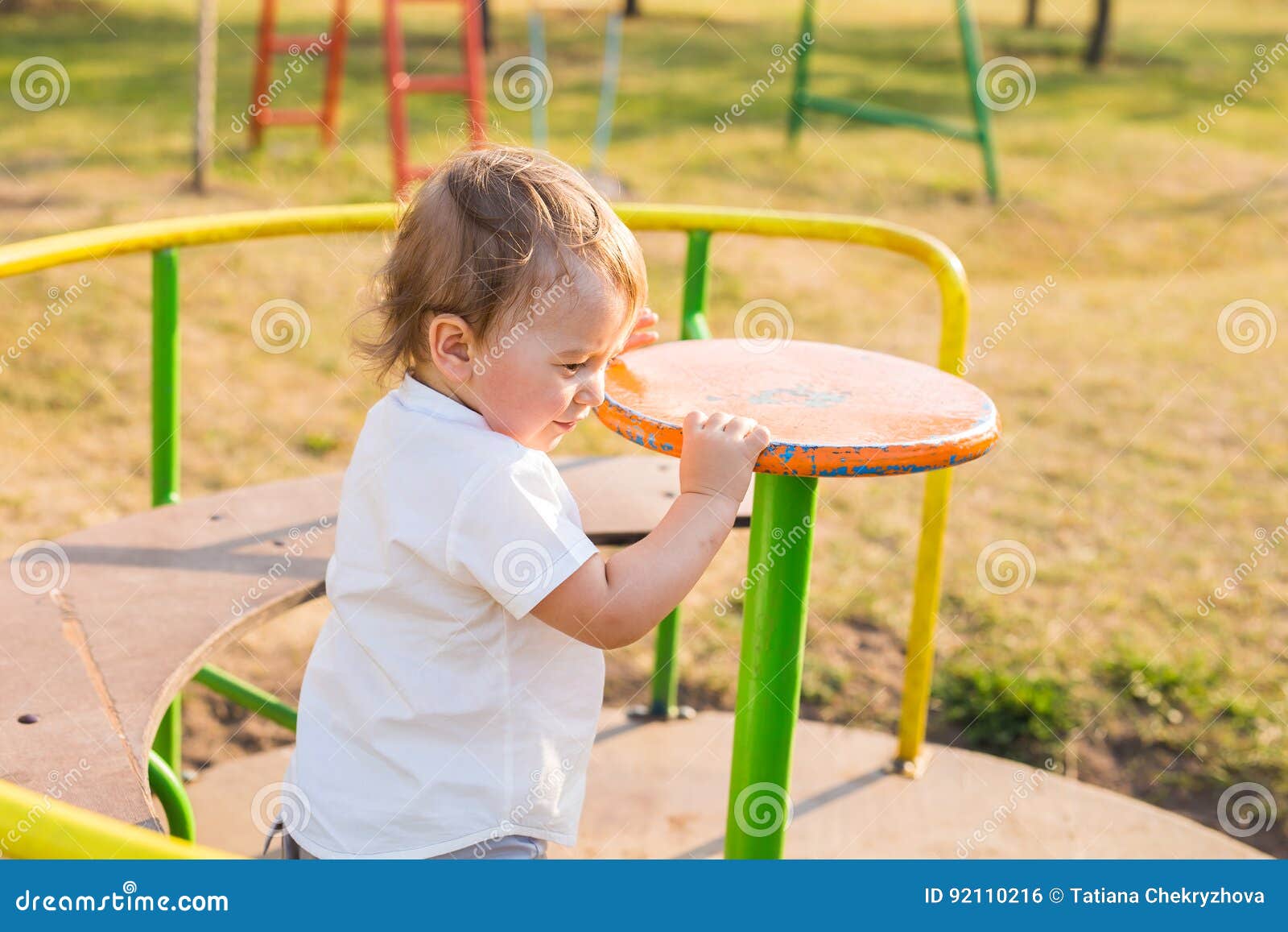 Happy Child Playing at a Playground. Stock Photo - Image of ...