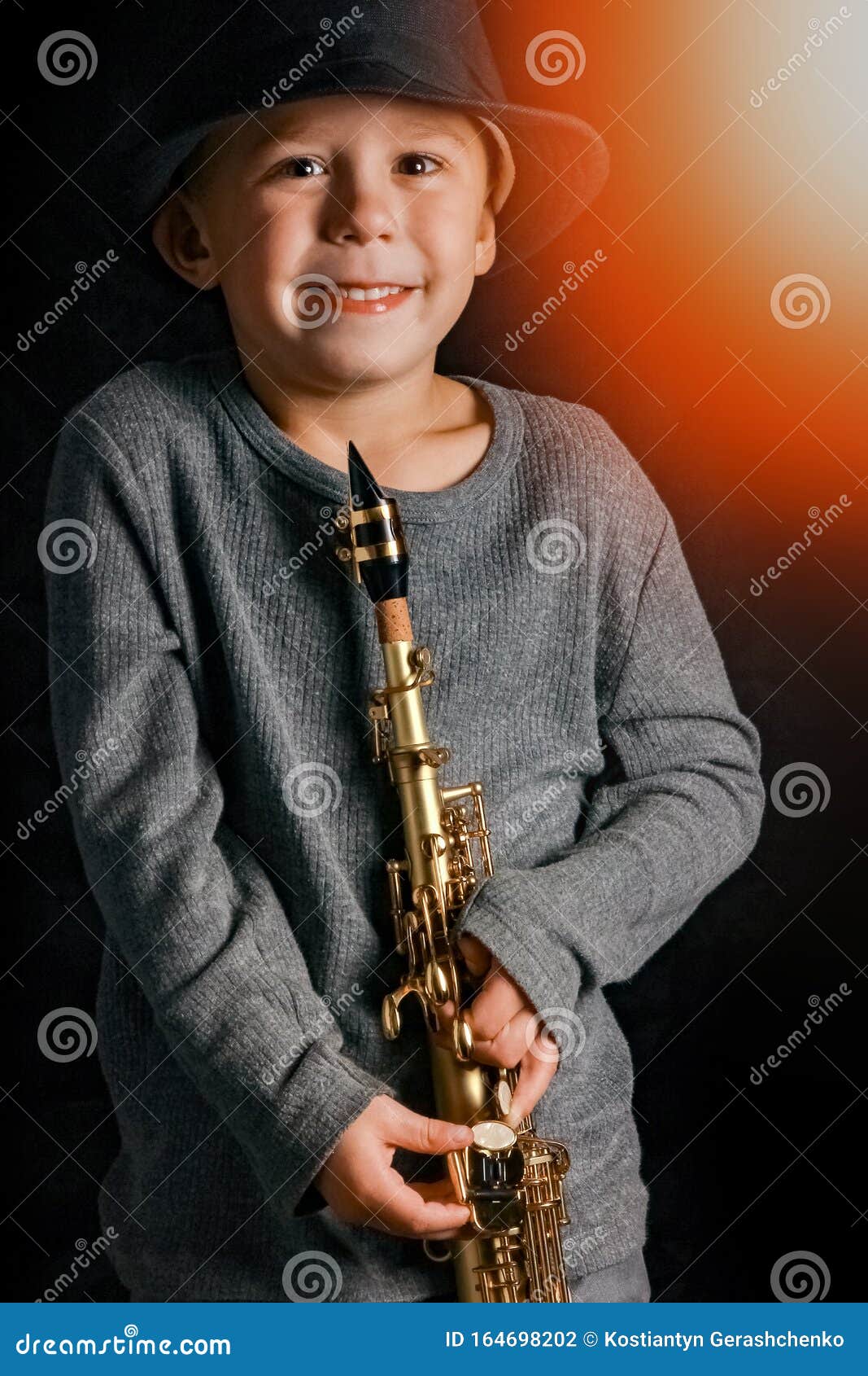 Happy Child Plays Saxophone in Studio Stock Photo - Image of person ...