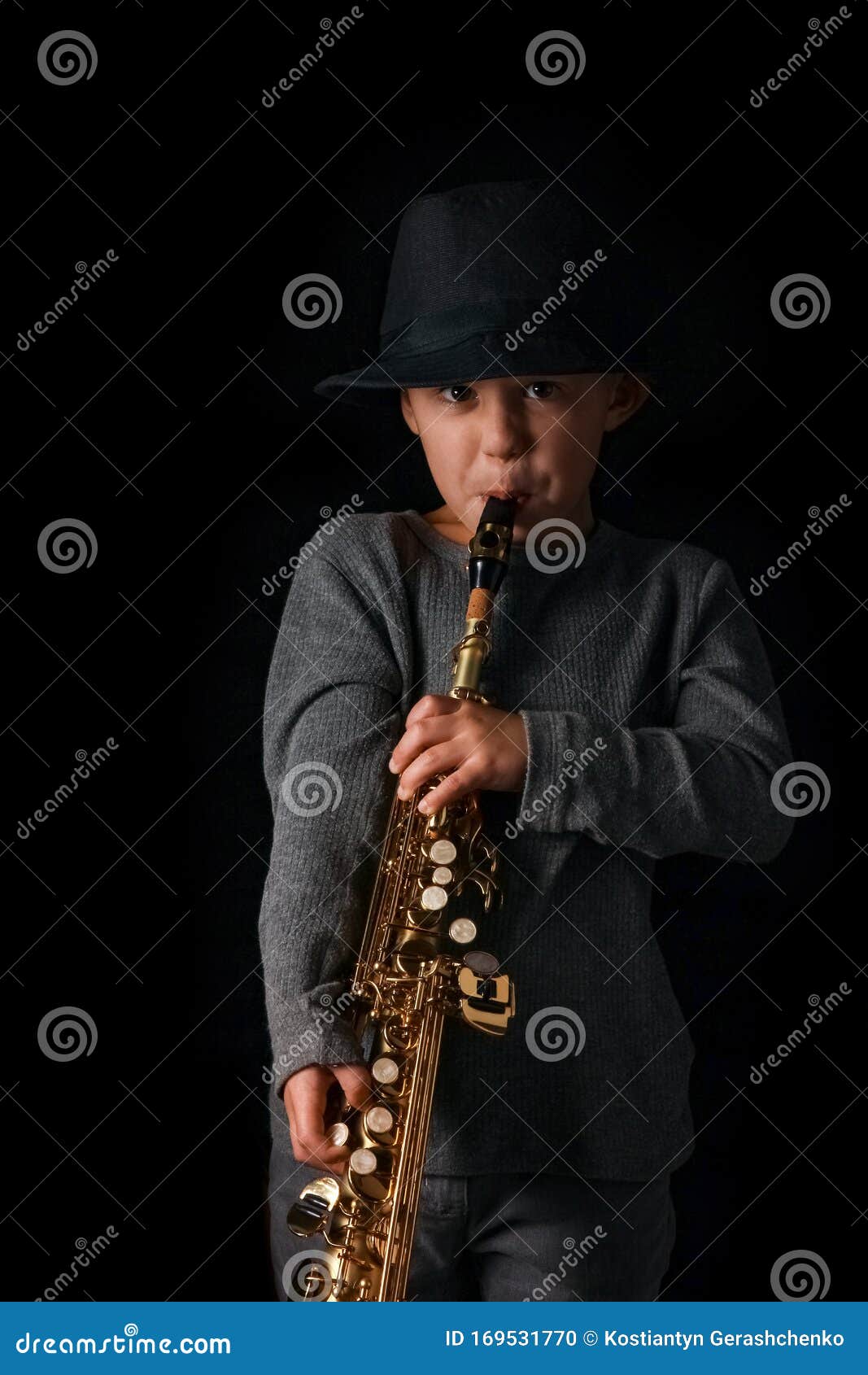 Happy Child Plays Saxophone in Studio Stock Photo - Image of player ...