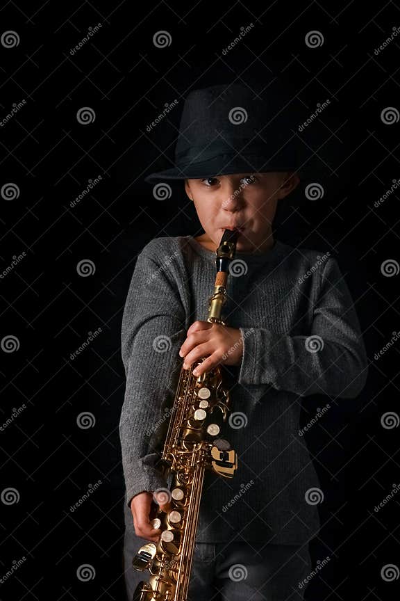 Happy Child Plays Saxophone in Studio Stock Photo - Image of player ...