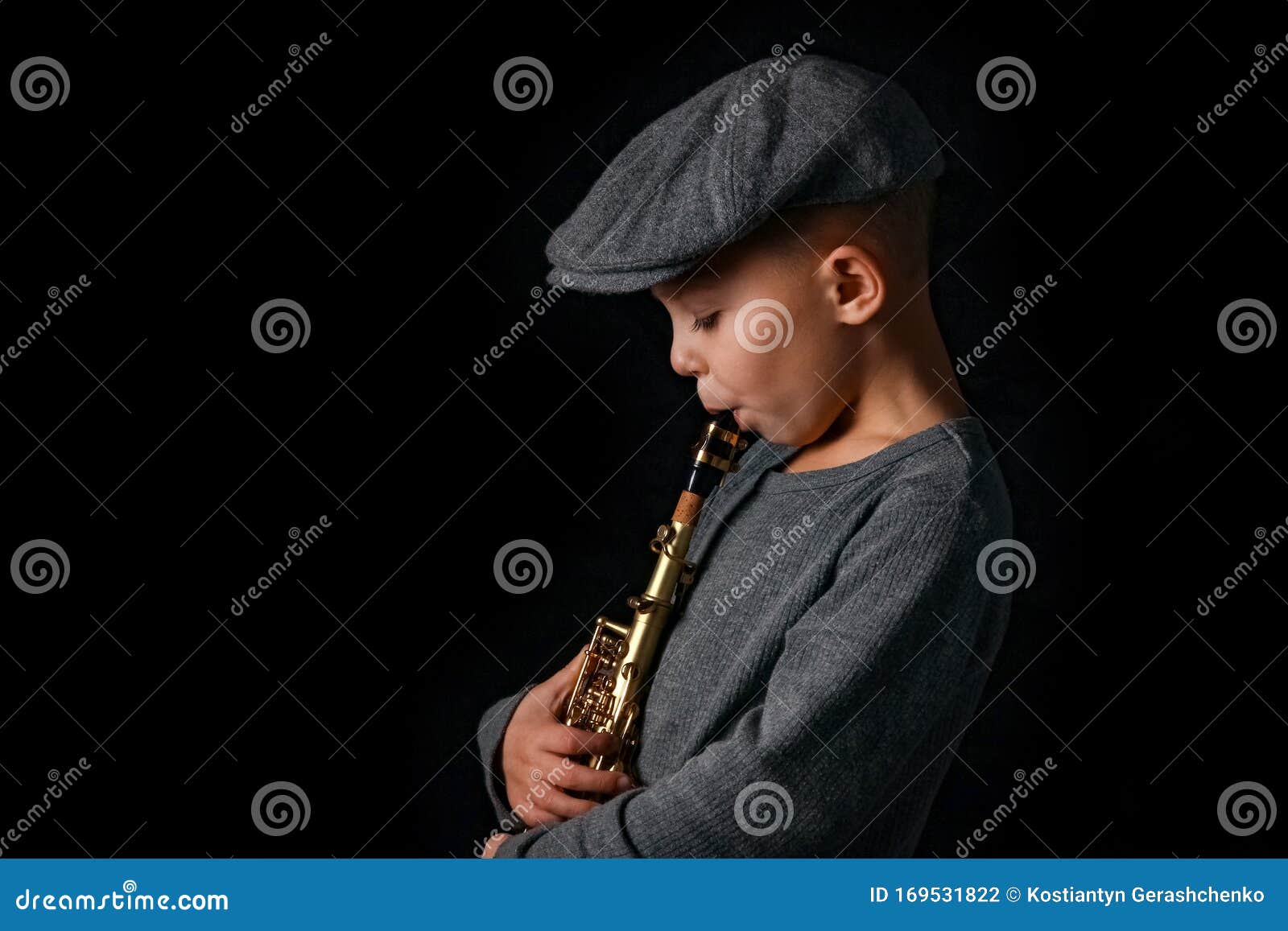 Happy Child Plays Saxophone in Studio Stock Photo - Image of band, male ...