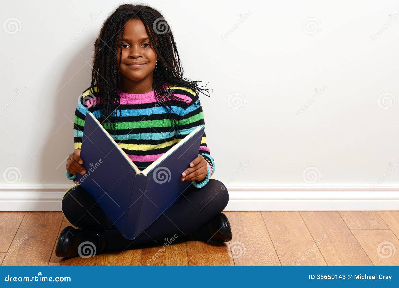 Happy child reading a book stock image. Image of hair - 35650143