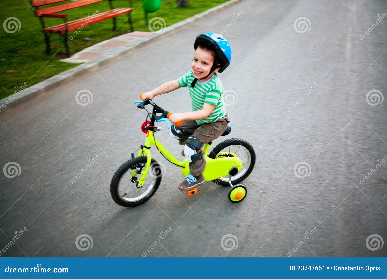 Happy child riding bike stock image. Image of protection - 23747651