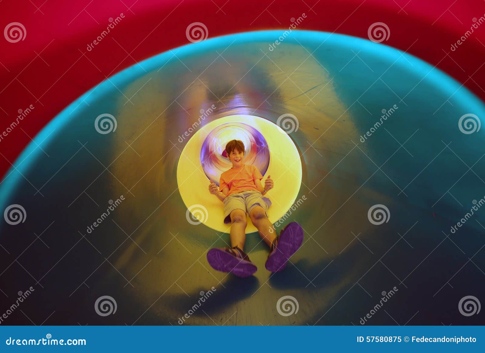 Happy Child Slides in Multicolored Tunnel Slide Stock Image - Image of ...