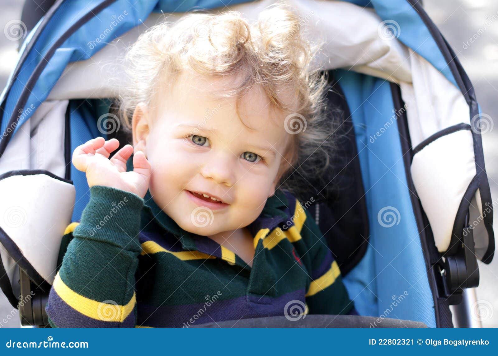 Happy Child in Stroller stock image. Image of sitting - 22802321