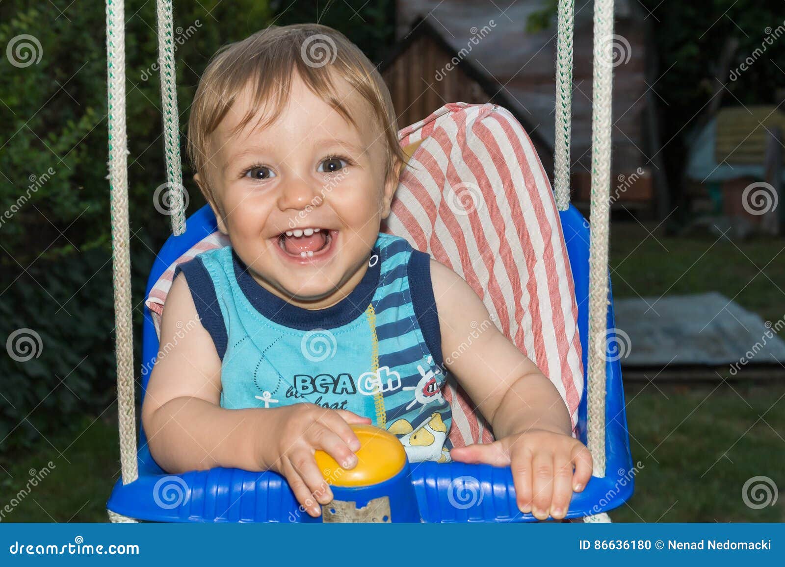 Happy child on swing stock photo. Image of emotion, child - 86636180
