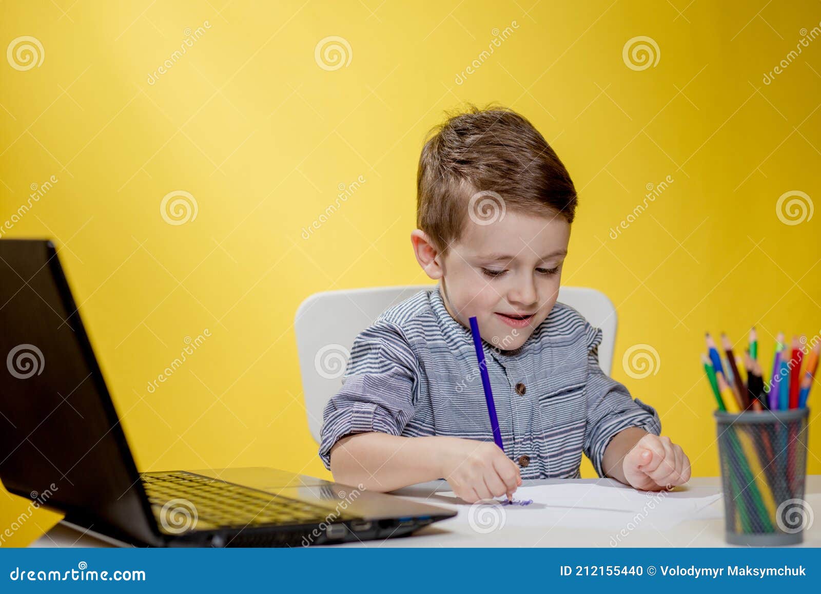 Happy Child Using Digital Laptop Doing Homework on Yellow Background ...