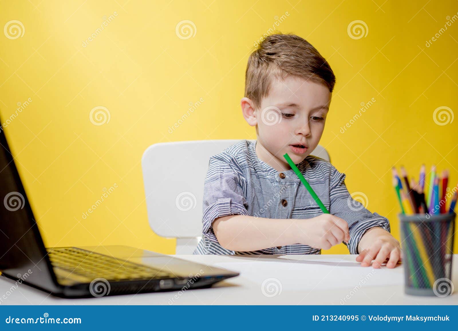 Happy Child Using Digital Laptop Doing Homework on Yellow Background ...