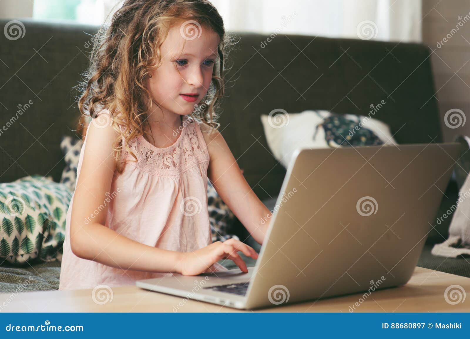 Happy Child Using Laptop at Home. School Girl Learning with Computer ...