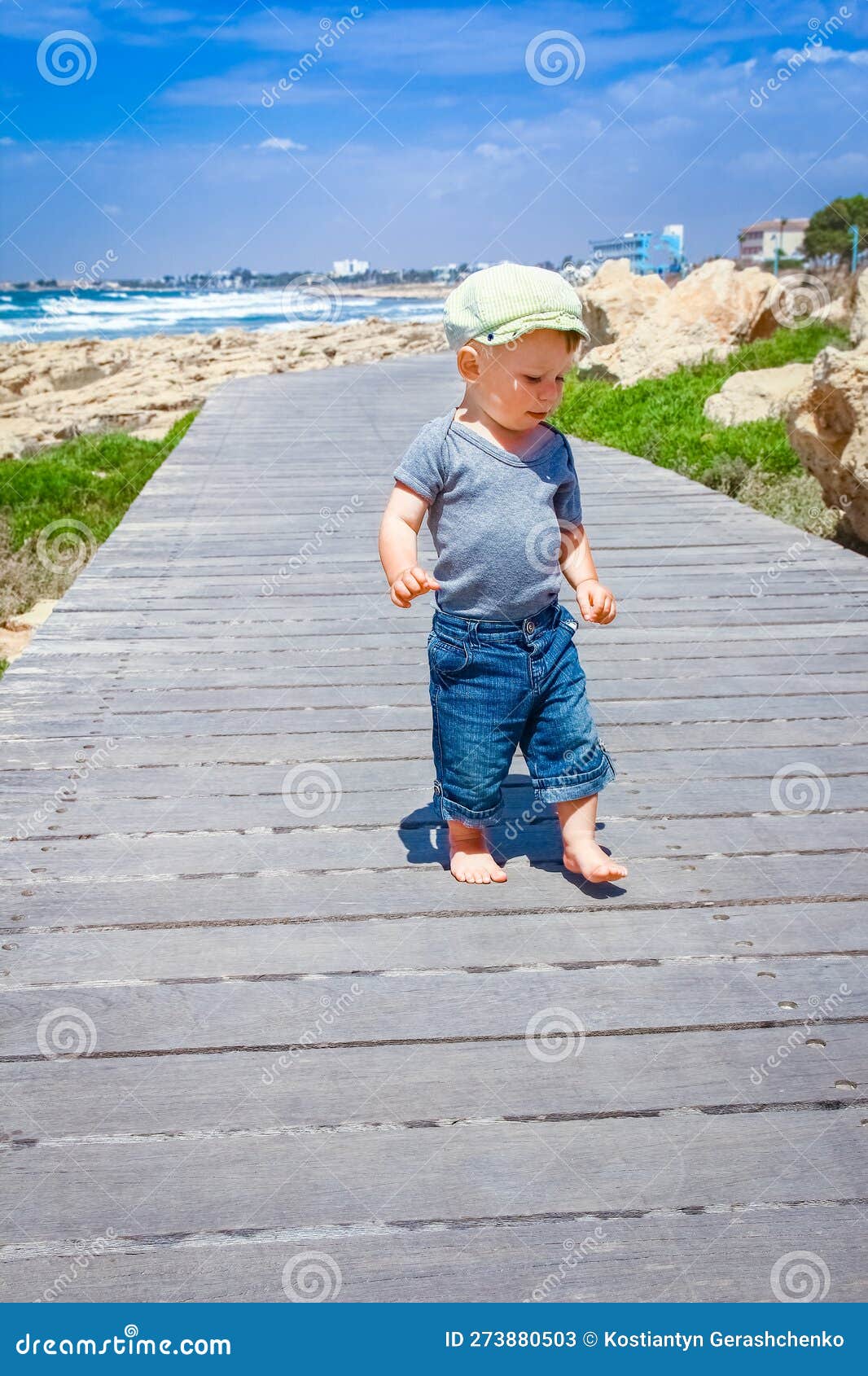 A Happy Child Walks Along the Path on the Nature by the Sea Stock Image ...