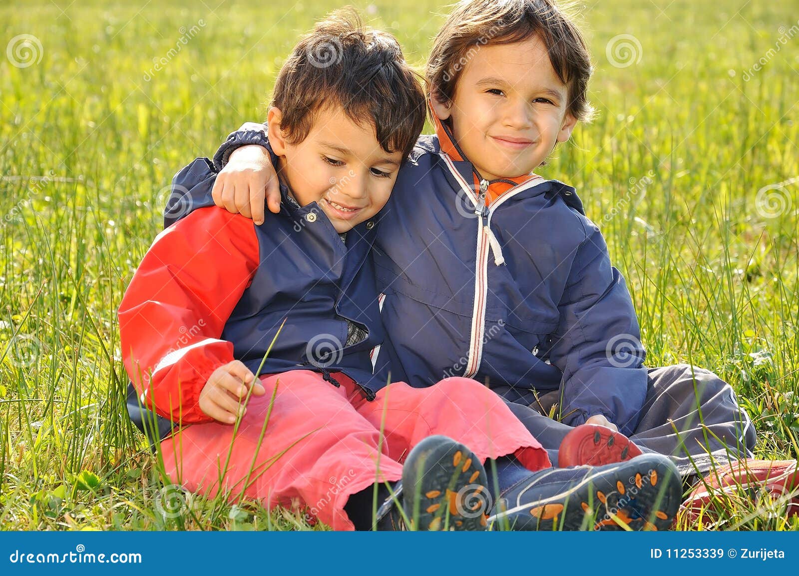 Happy childhood on green stock image. Image of clothes - 11253339