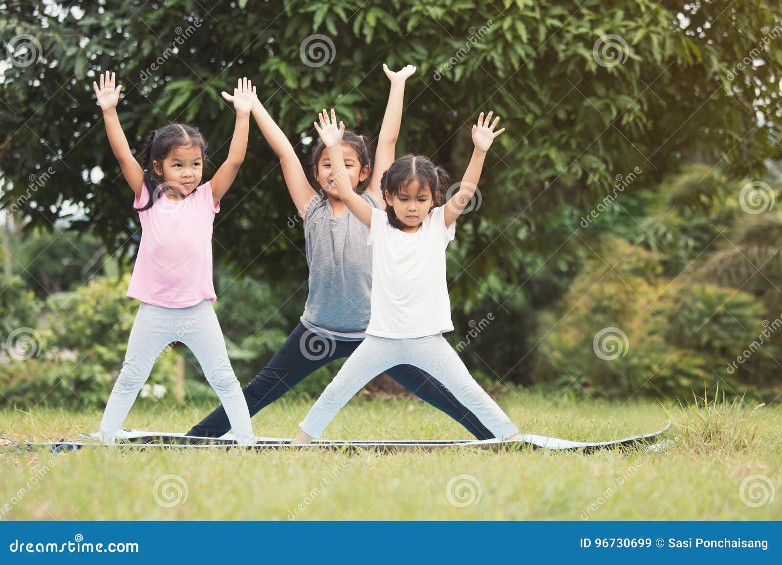 Happy Children Doing Exercise Together in Outdoor Stock Image - Image ...