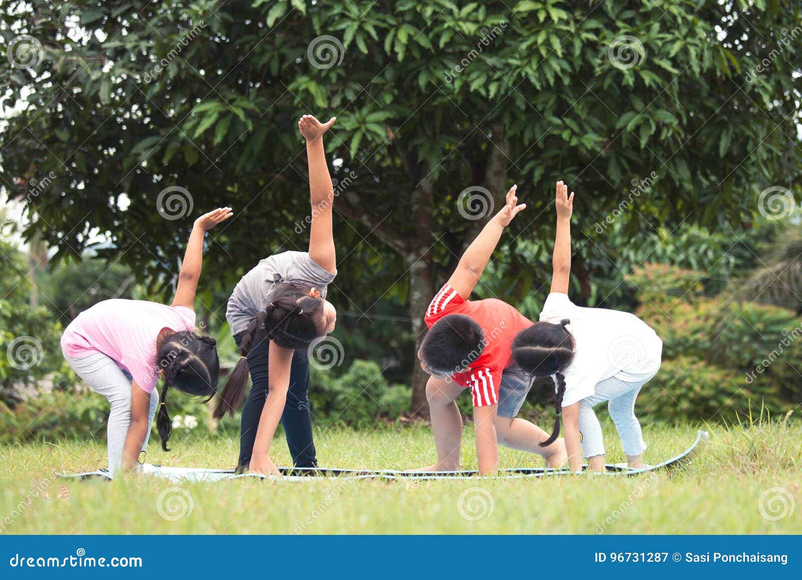 Happy Children Doing Exercise Together in Outdoor Stock Image - Image ...