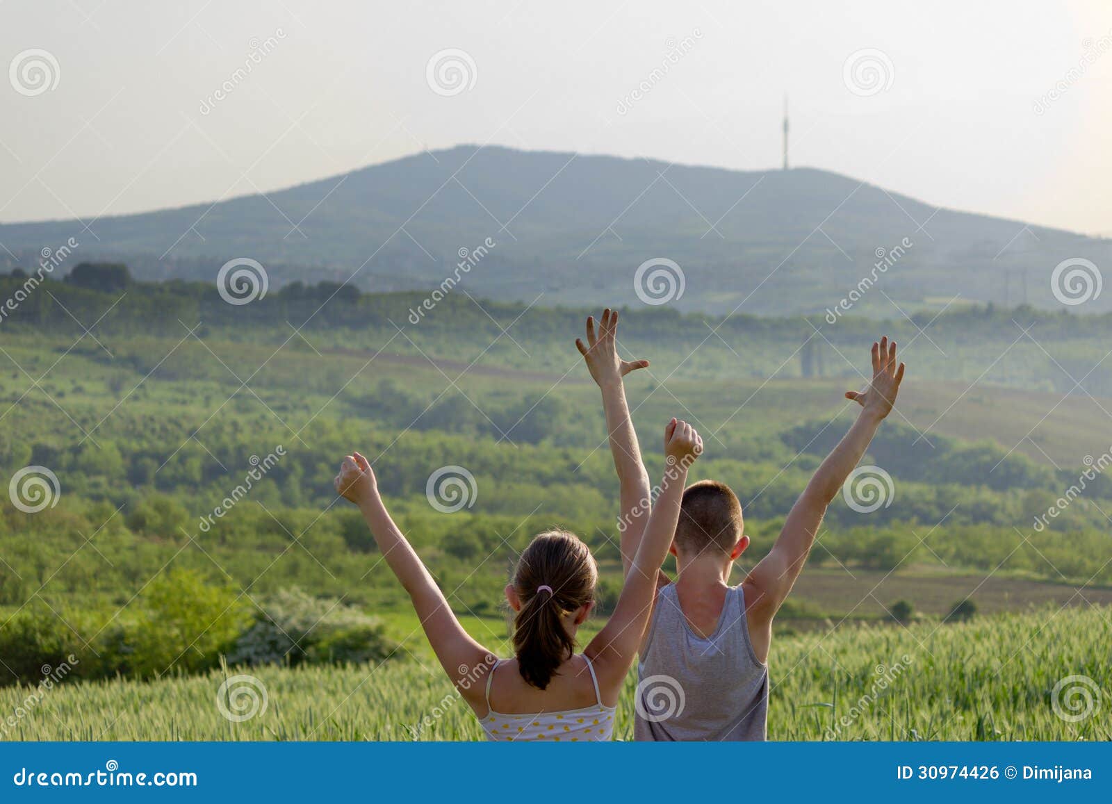 Happy Children Enjoy the Field Stock Photo - Image of planet, hill ...