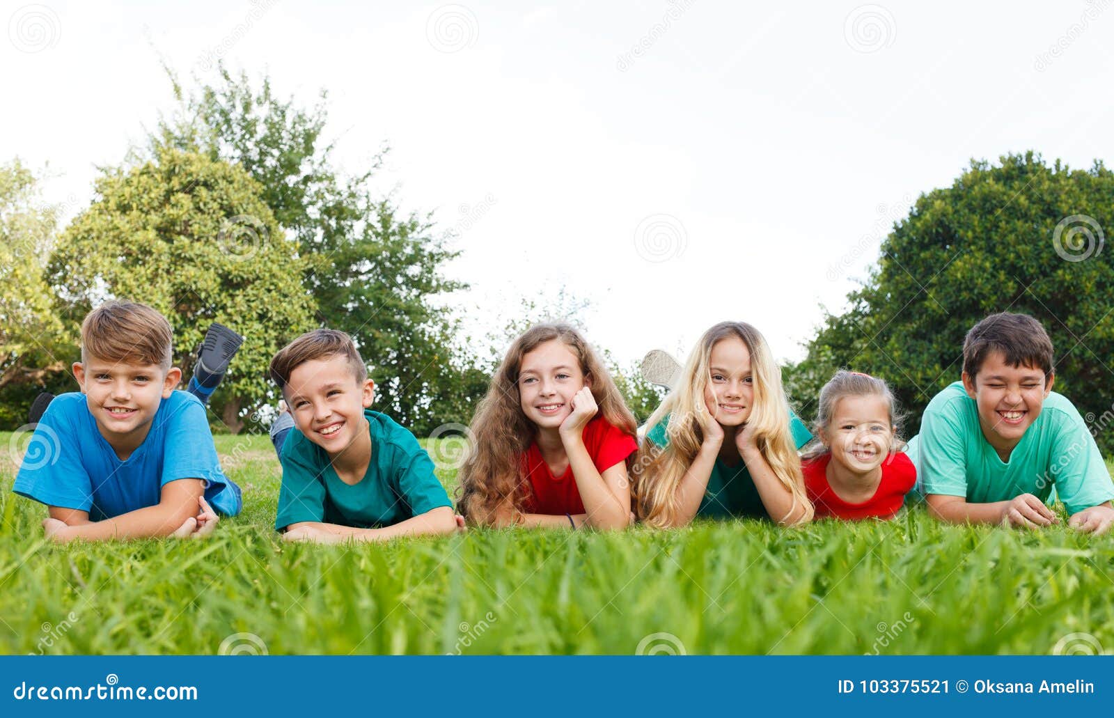 Happy Children on the Grass Stock Image - Image of color, camera: 103375521
