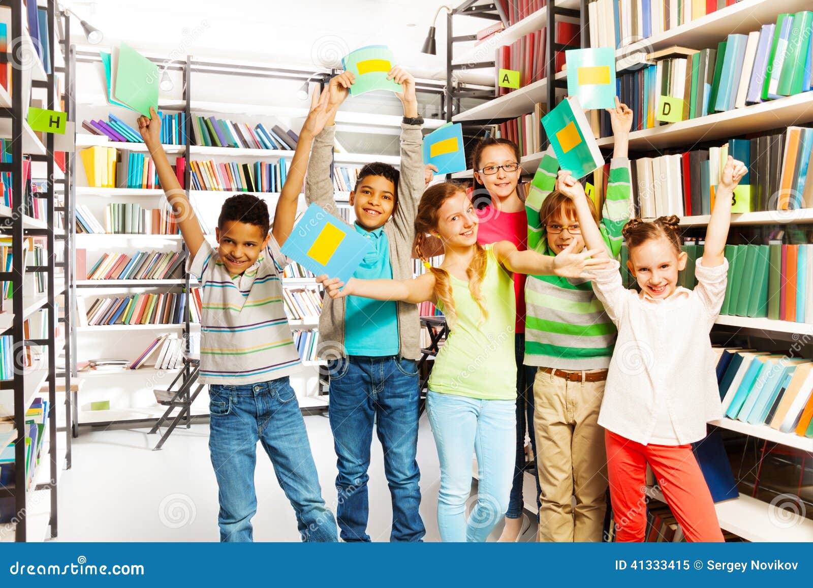 Happy Children with Hands Up Hold Exercise Books Stock Image - Image of ...