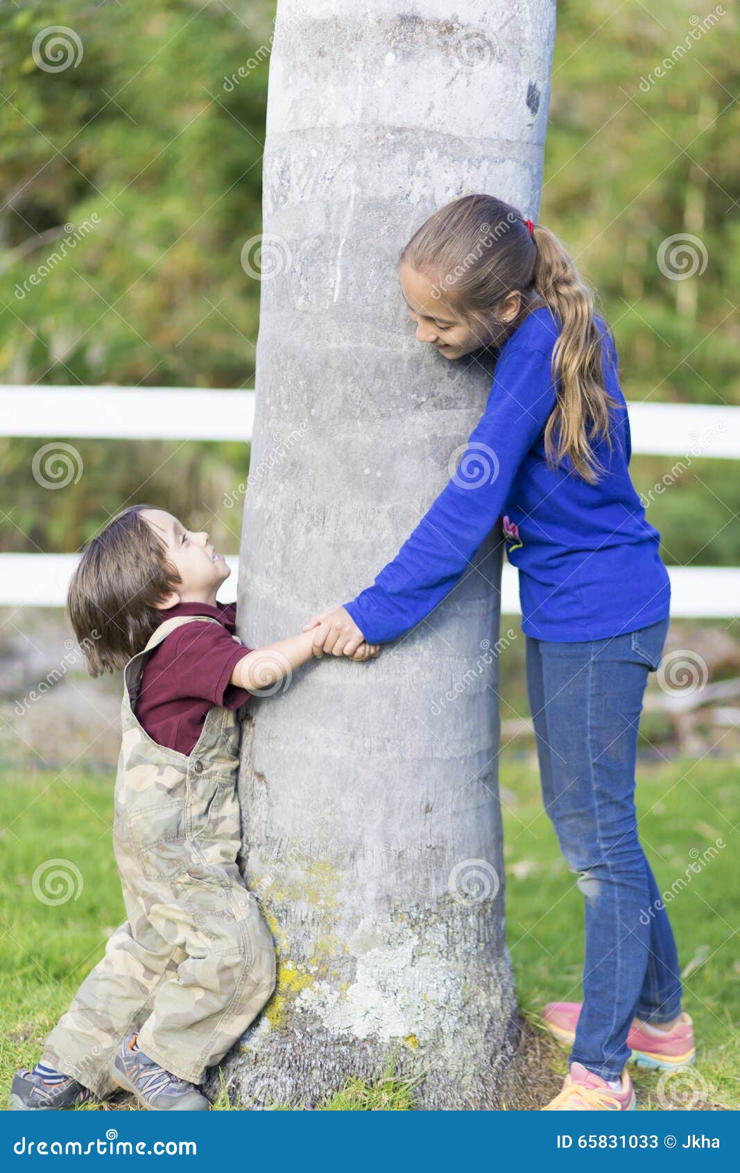 Happy Children Hugging a Tree Stock Image - Image of love, bole: 65831033